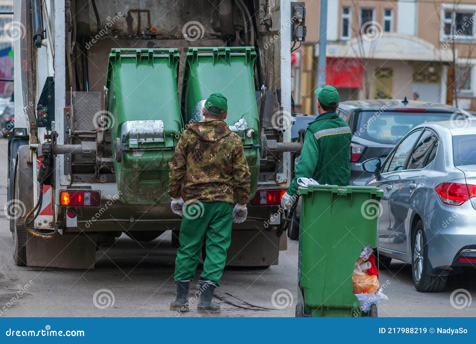 Garbage Truck and Workers Collecting Solid Waste in Residential Area ...