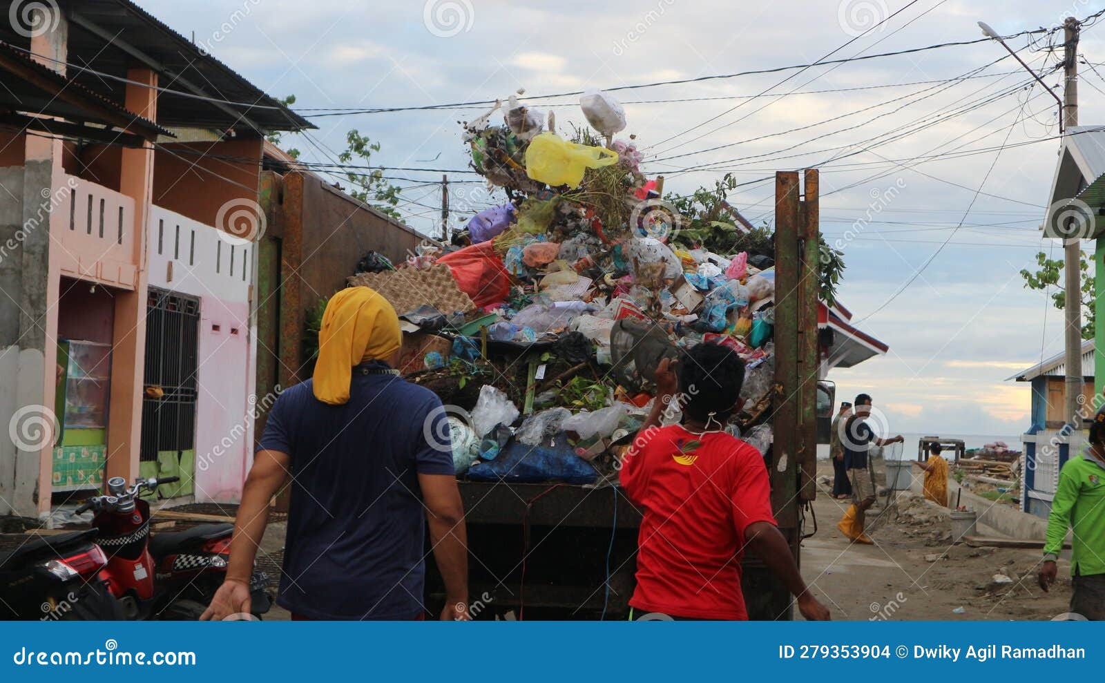 Garbage Worker Loading Garbage into a Truck Editorial Stock Image ...