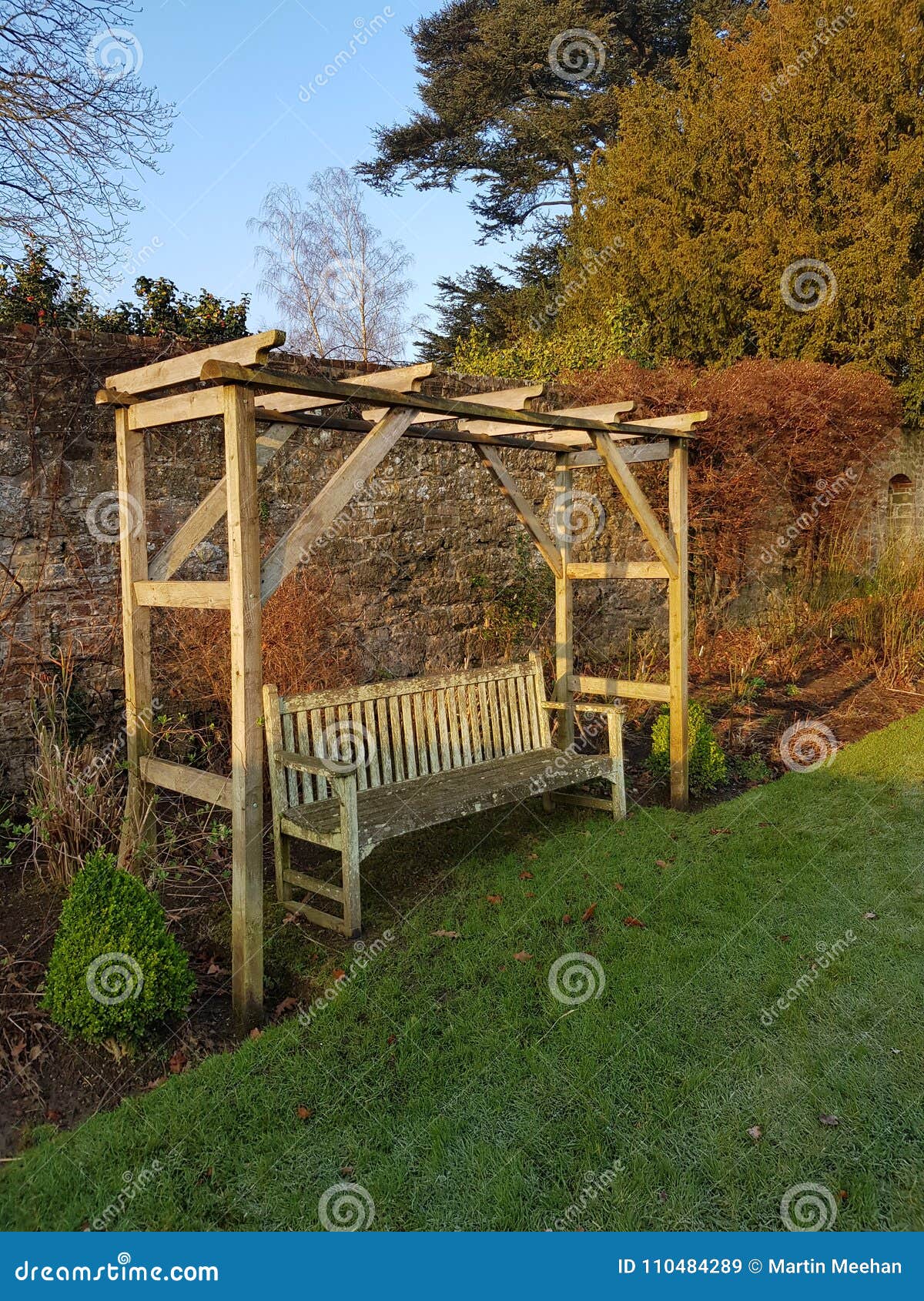 Garden arbor with bench. stock image. Image of covering - 110484289