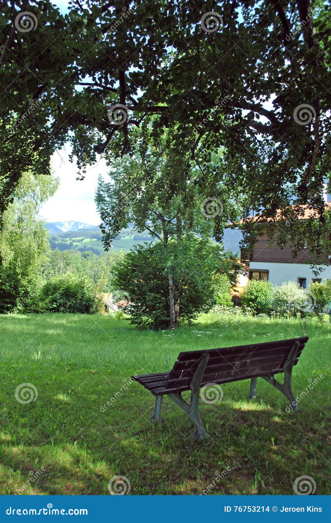 Garden bench with a view stock photo. Image of shadow - 76753214