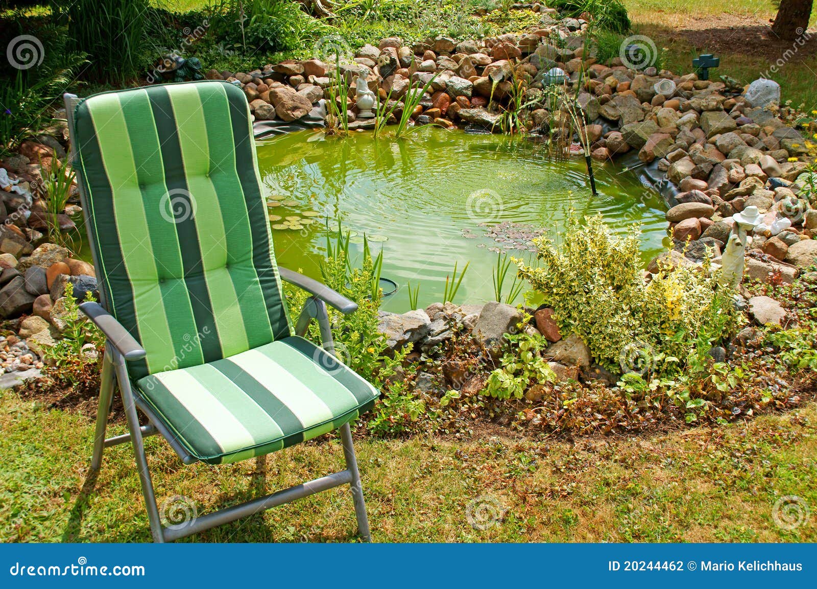Garden chair and pond stock photo. Image of landscape - 20244462