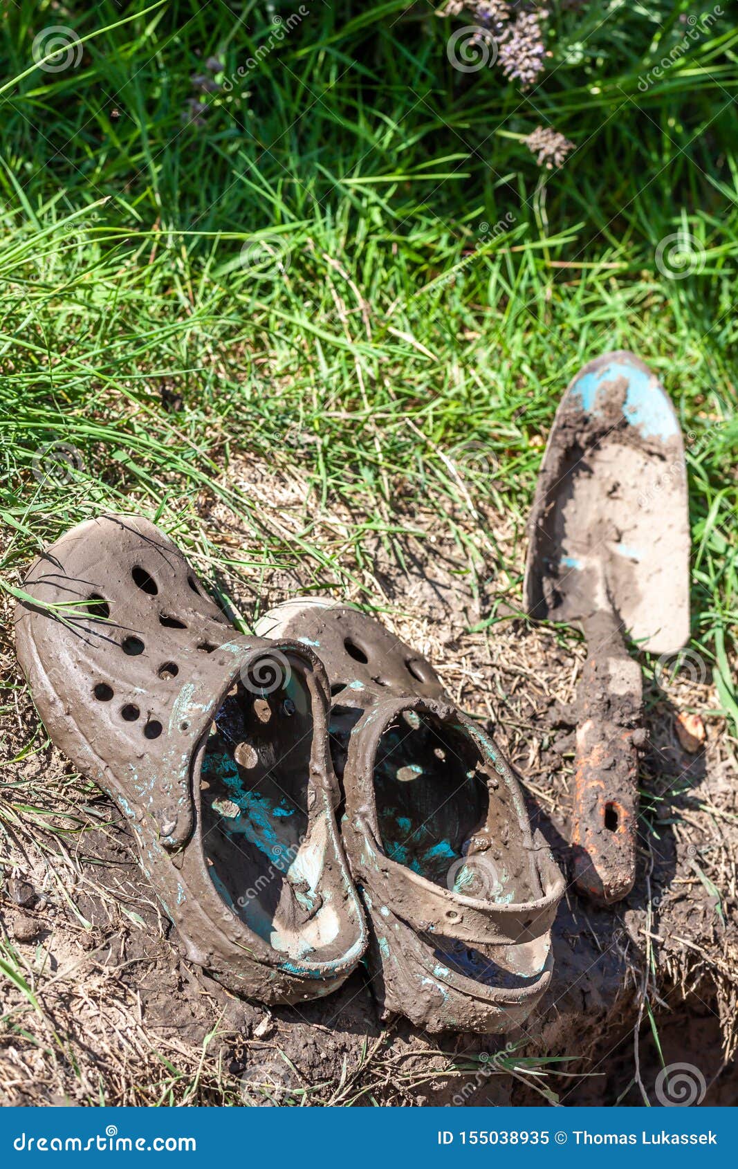 Garden Clogs and Shovel Standing on the Mud Stock Image - Image of play ...