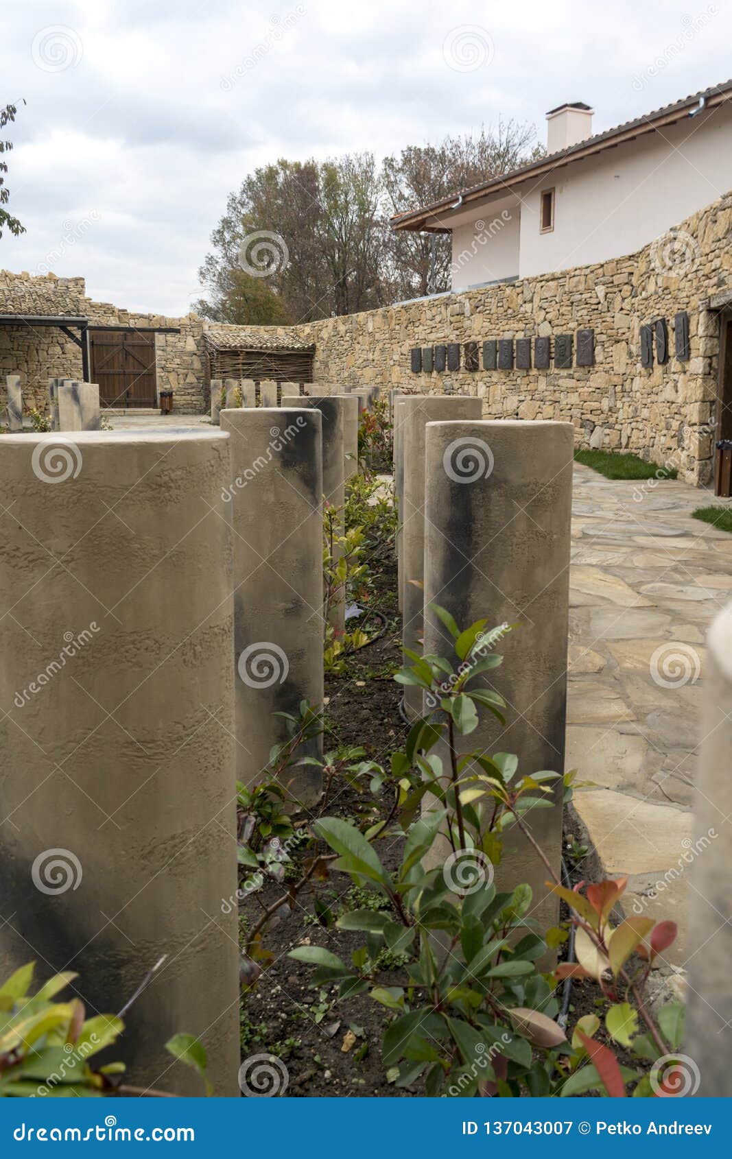 Garden of Flowers, Interesting Concrete Cylinders and Shed Stock Image ...