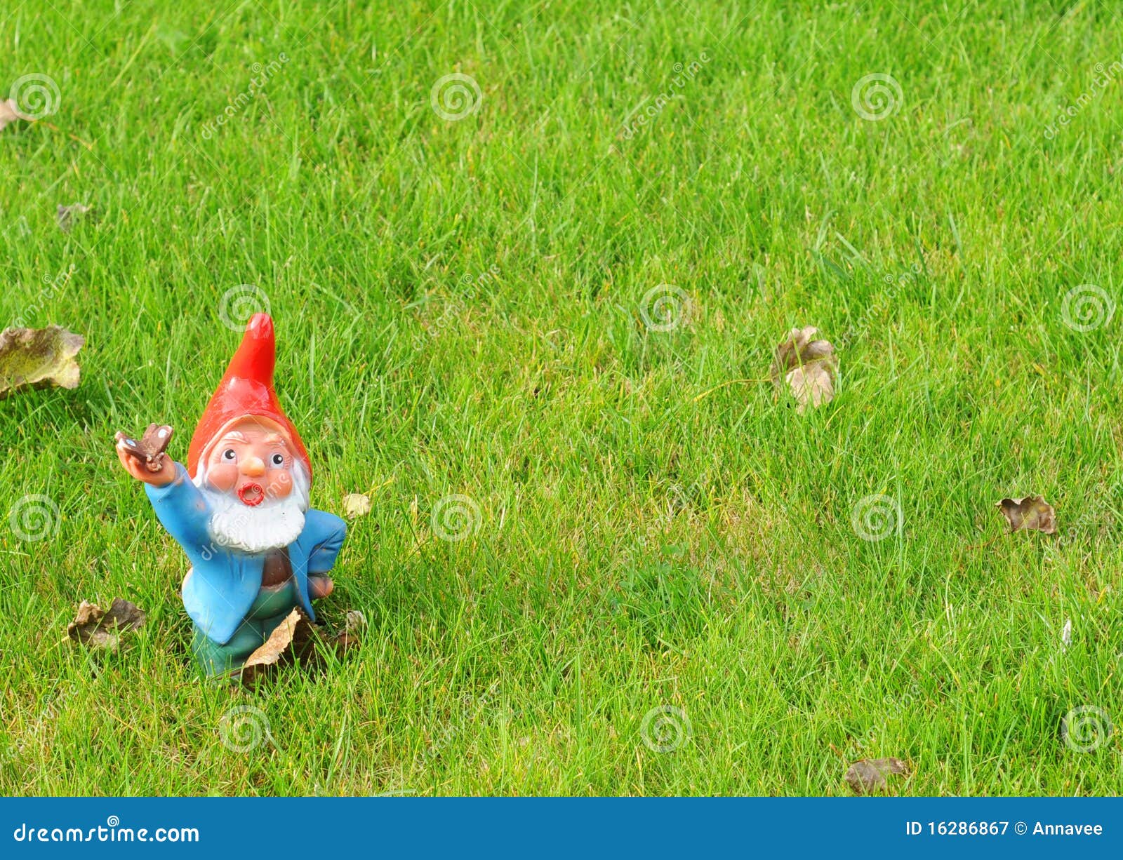 Garden Gnome in Bright Colours Waving in the Grass Stock Image - Image ...