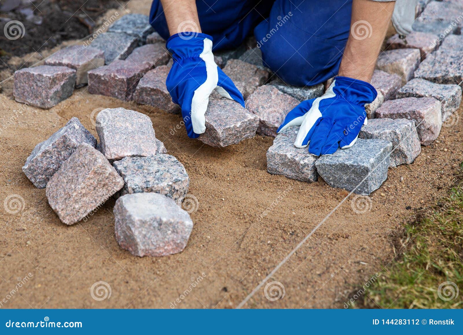 Garden Path Construction - Worker Laying Granite Stone Pavers Stock ...