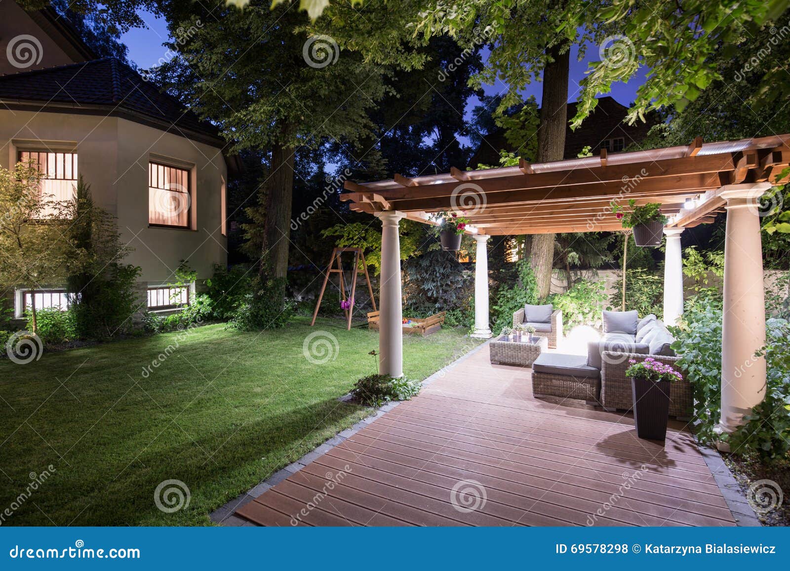Garden with patio at night stock photo. Image of luxury - 69578298