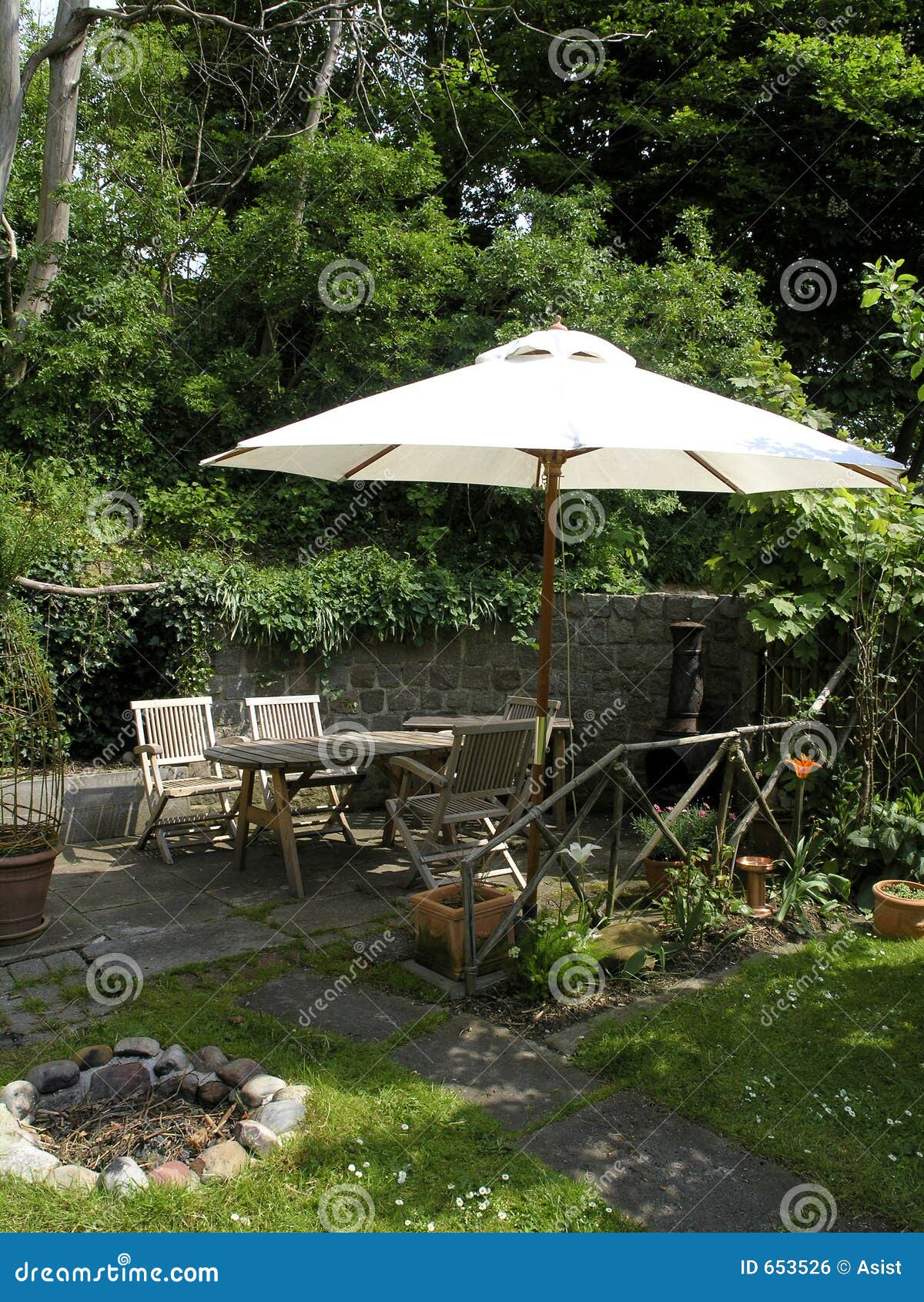 Garden setting stock photo. Image of bench, umbrella, party - 653526