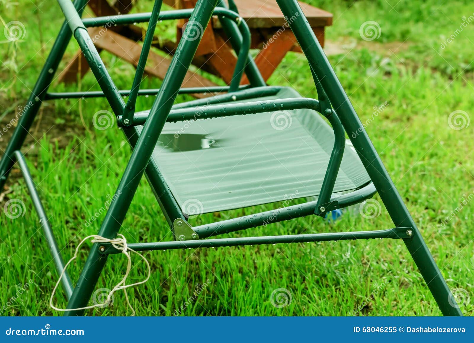 Garden swing after rain stock image. Image of garden - 68046255