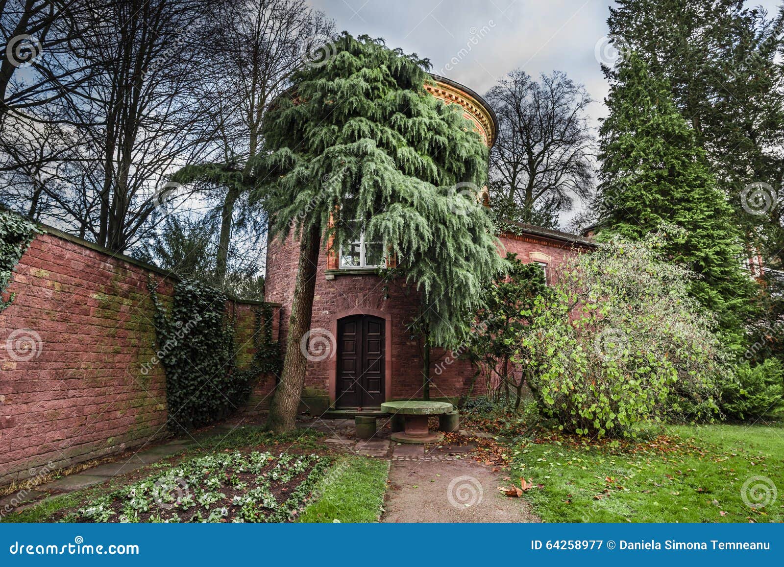 Garden Table and Round Stone Tower Stock Image - Image of tower, wall ...