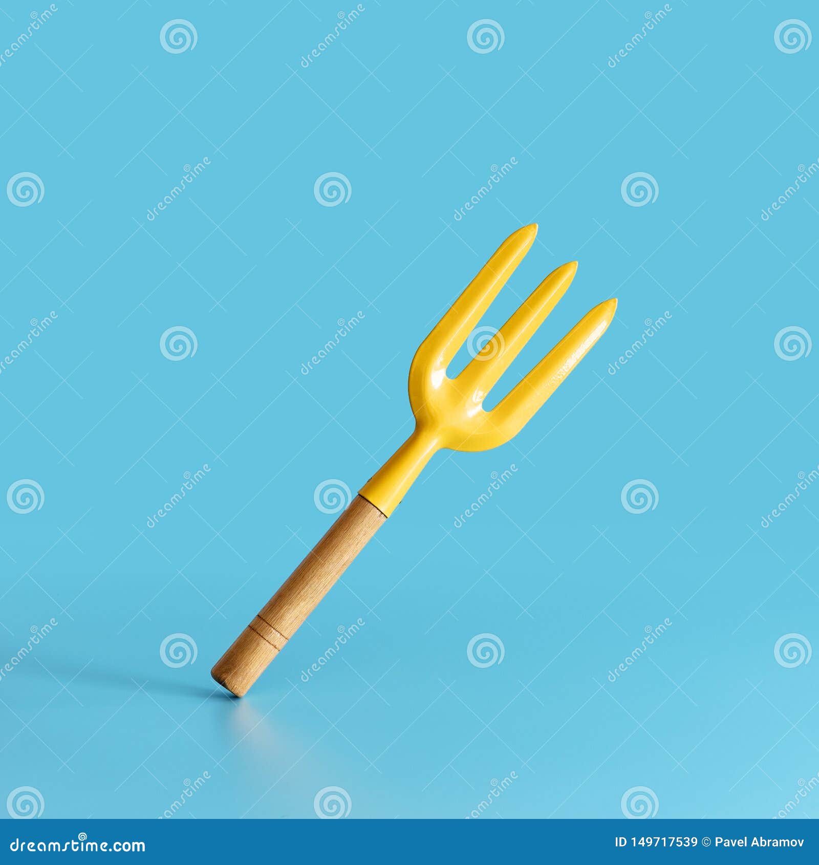 Garden Tool. Yellow Fork on Blue Background Stock Image - Image of ...