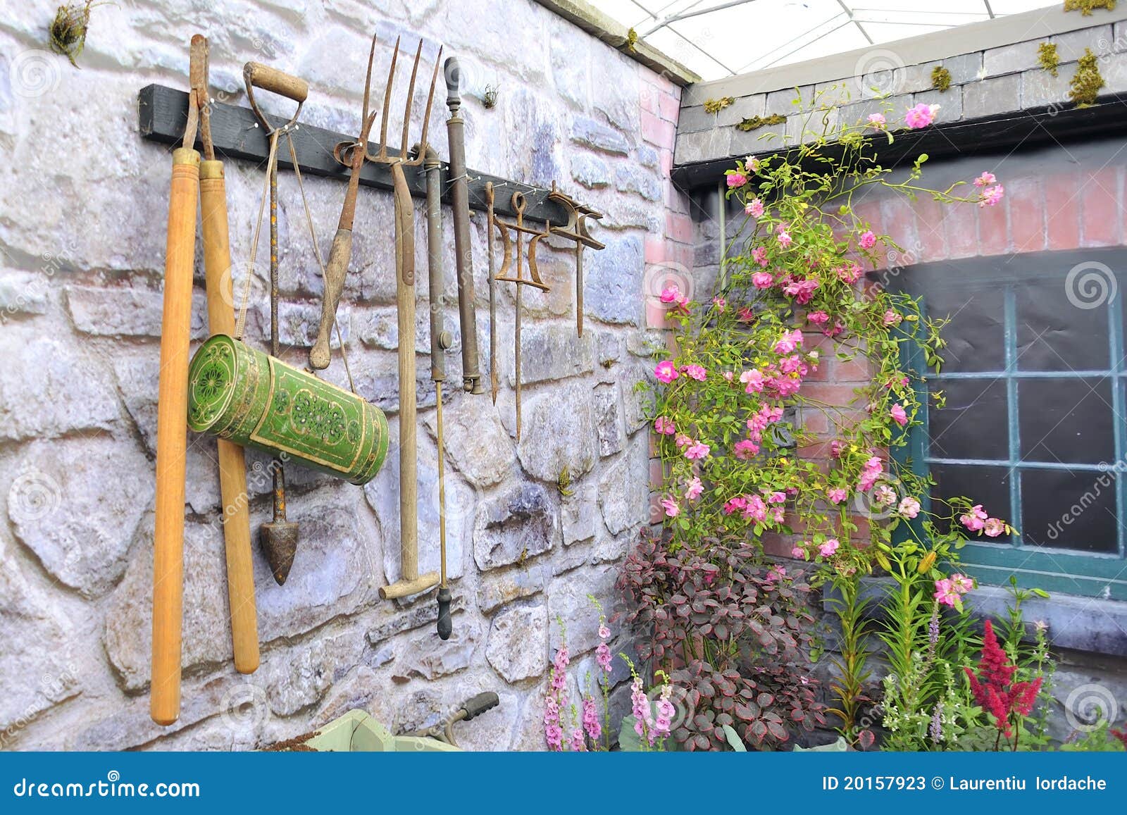 Garden tools on stone wall stock image. Image of working - 20157923