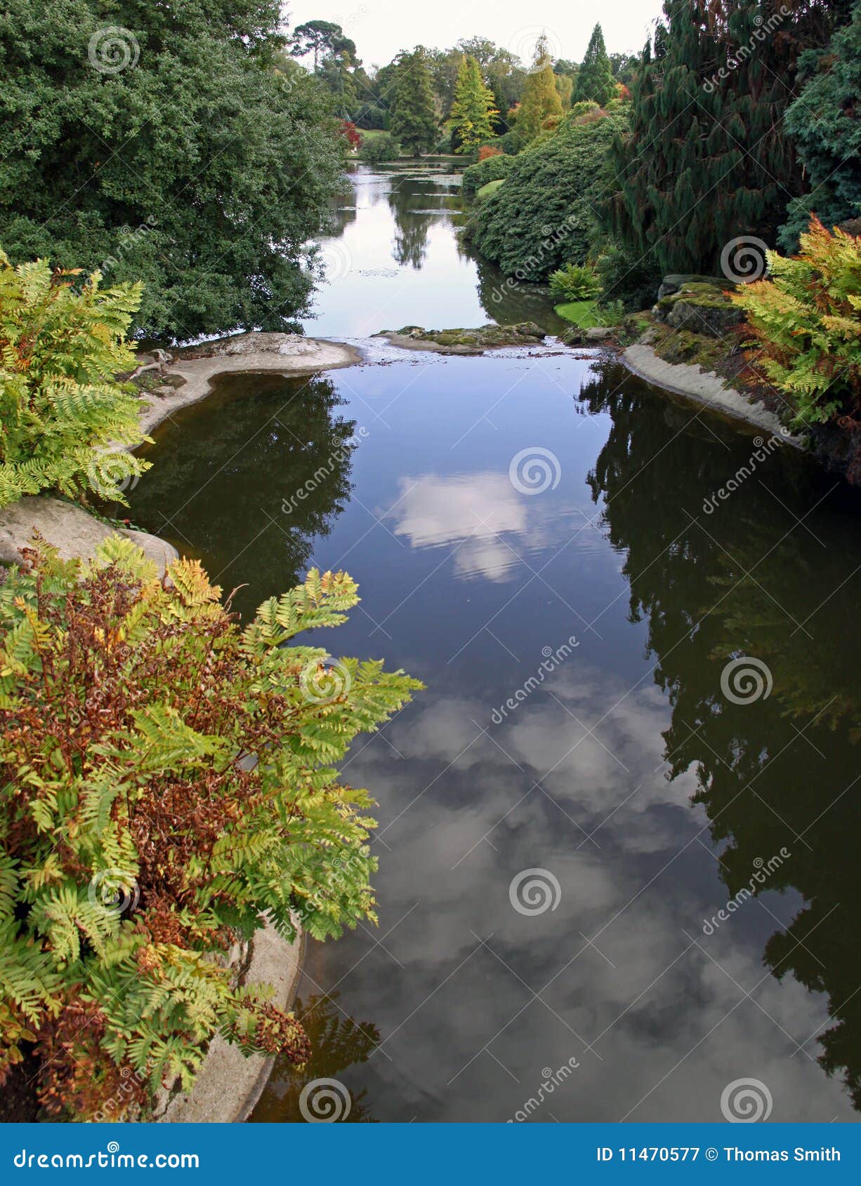 Garden Waterfall Over a Rockery Stock Image - Image of cascade, water ...