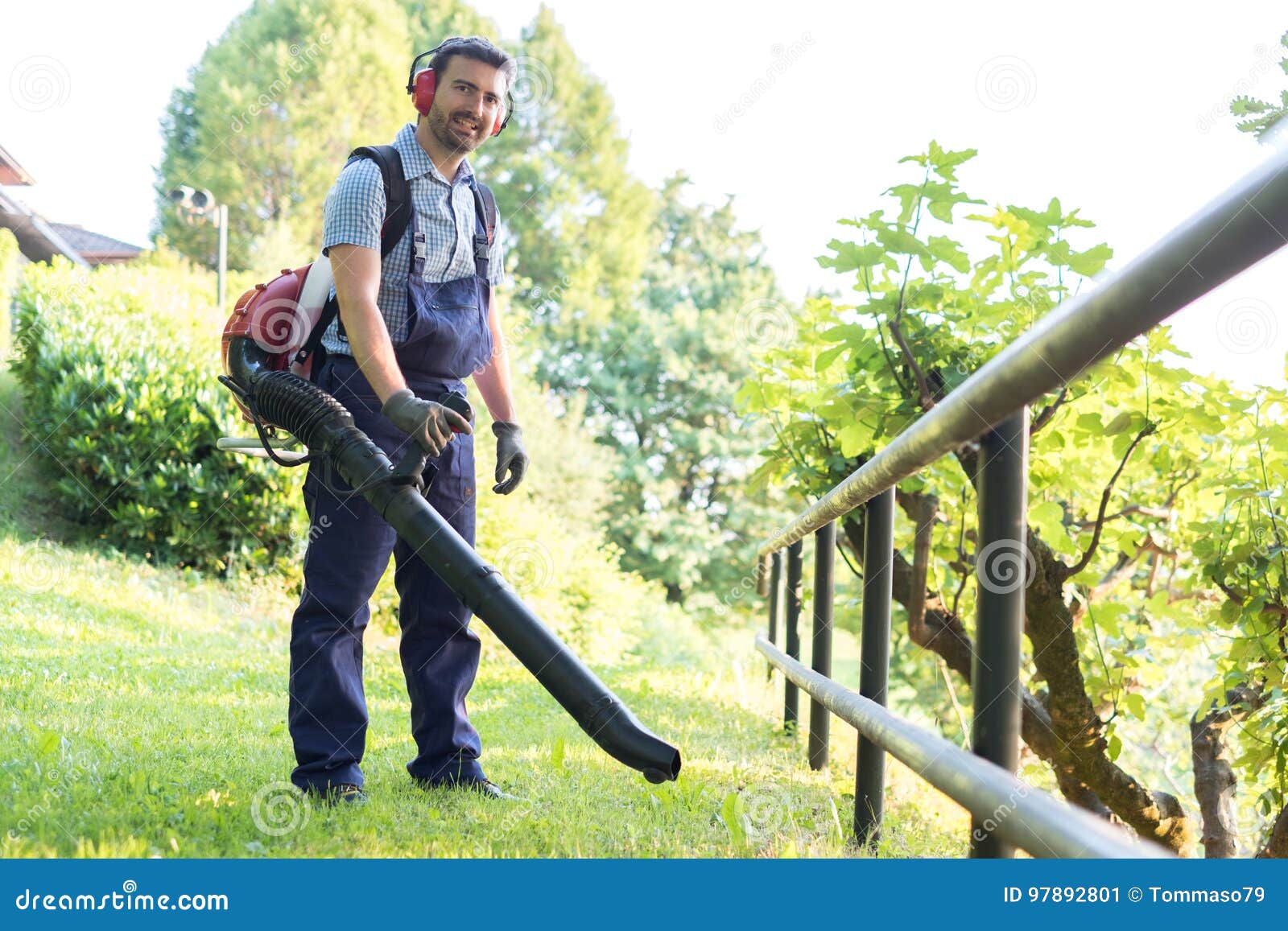 Gardener Clearing Up the Leaves Using a Leaf Blower Stock Image - Image ...