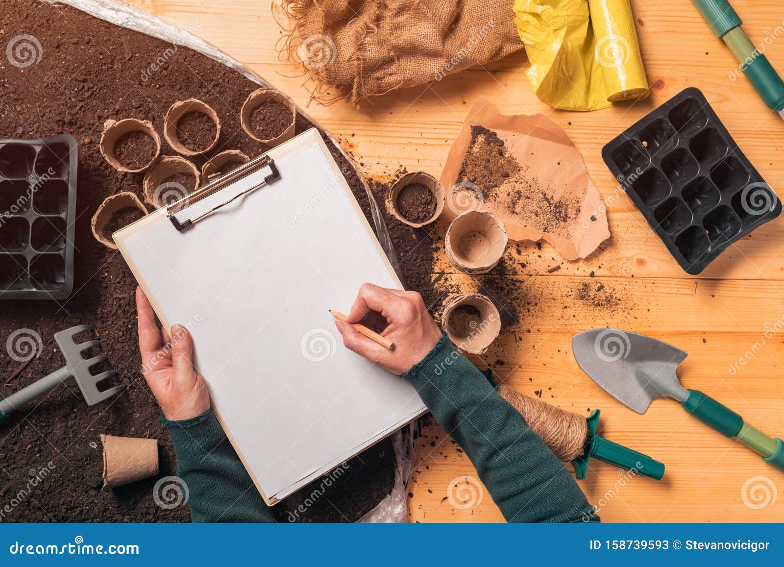 Gardener Writing Notes on Clipboard Note Paper, Mock Up Stock Image ...