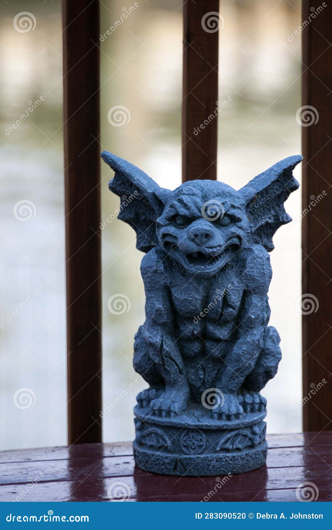 Gargoyle sitting watch stock photo. Image of monument - 283090520