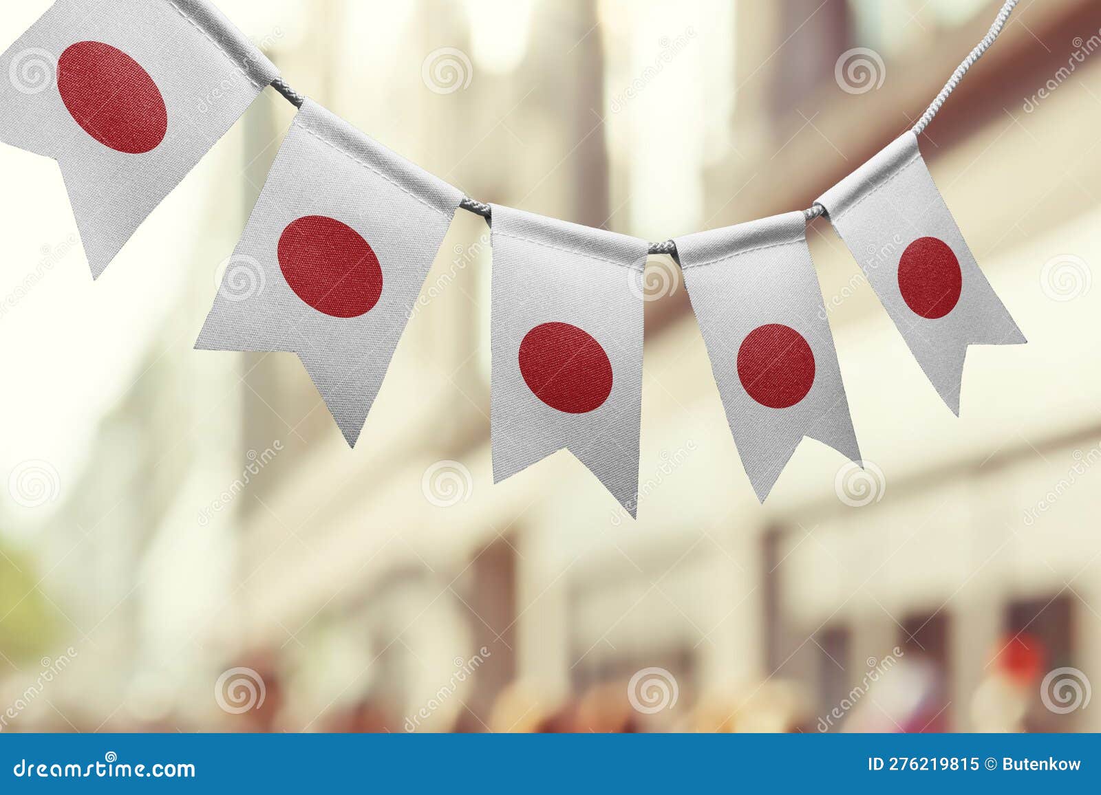 A Garland of Japan National Flags on an Abstract Blurred Background ...