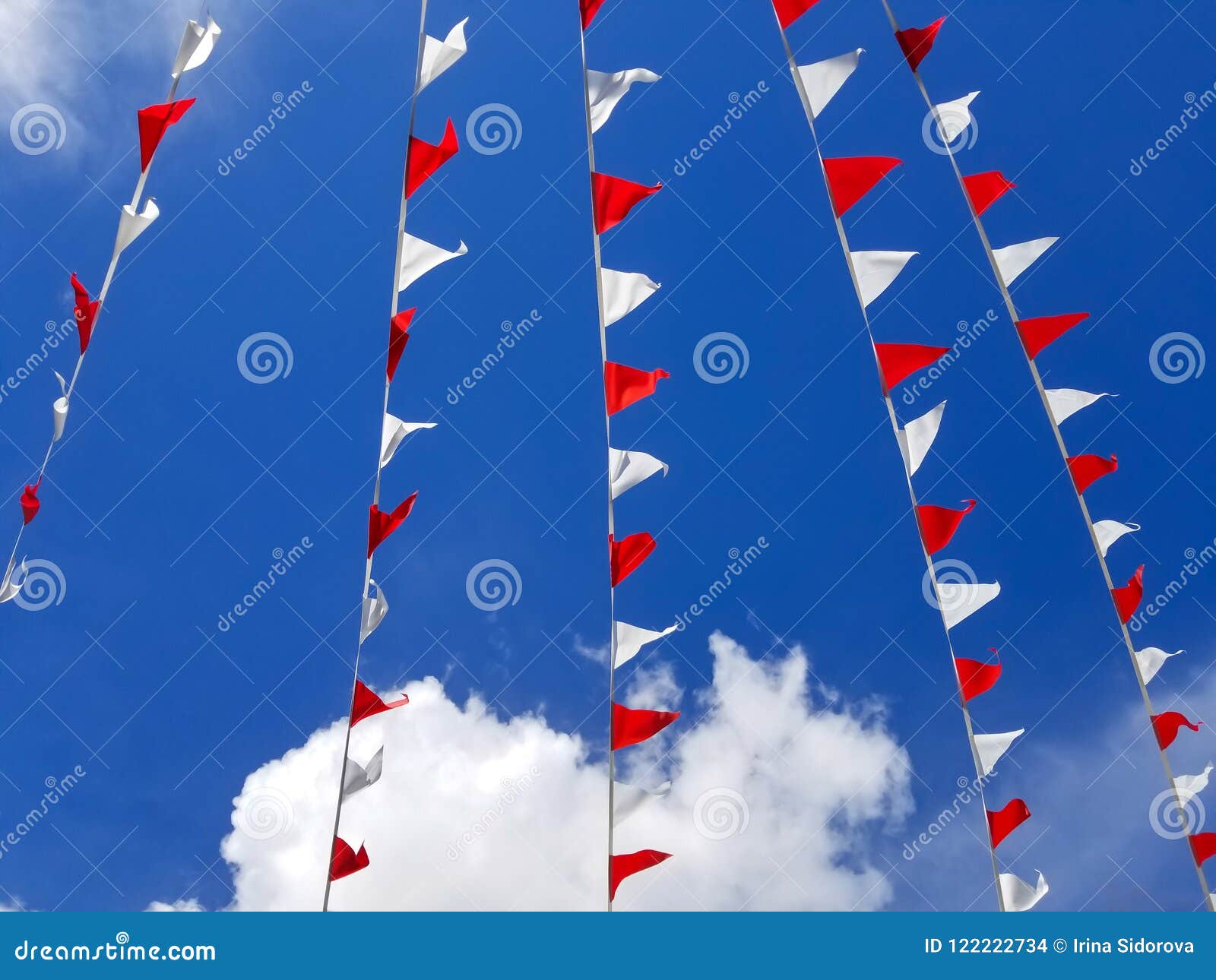 Garland of Red and White Triangle Flags on Blue Sky Background Stock ...