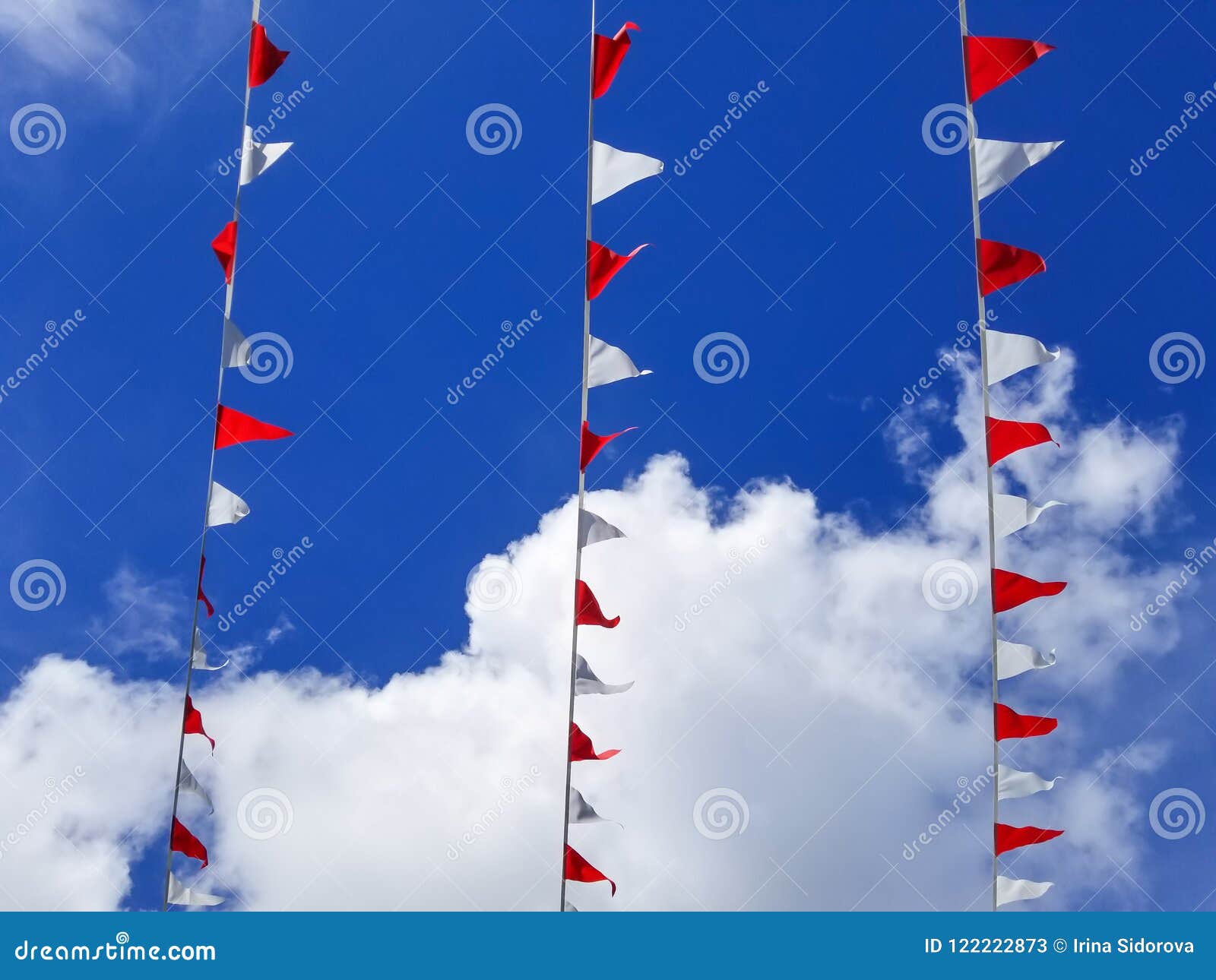 Garland of Red and White Triangle Flags on Blue Sky Background Stock ...