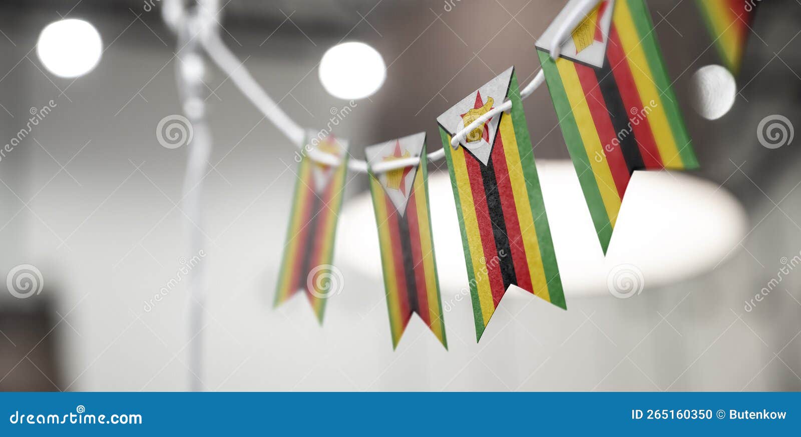 A Garland of Zimbabwe National Flags on an Abstract Blurred Background ...