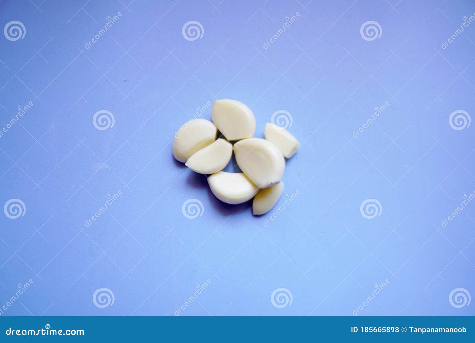 A Garlic on a Blue Background Stock Photo - Image of chopping, cooking ...