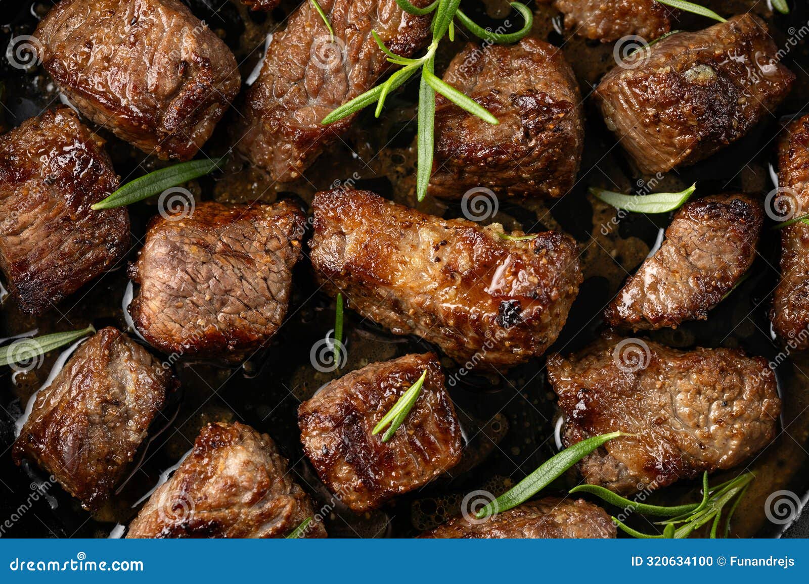 Garlic Butter Beef Steak Bites in Iron Cast Pan Stock Photo - Image of ...