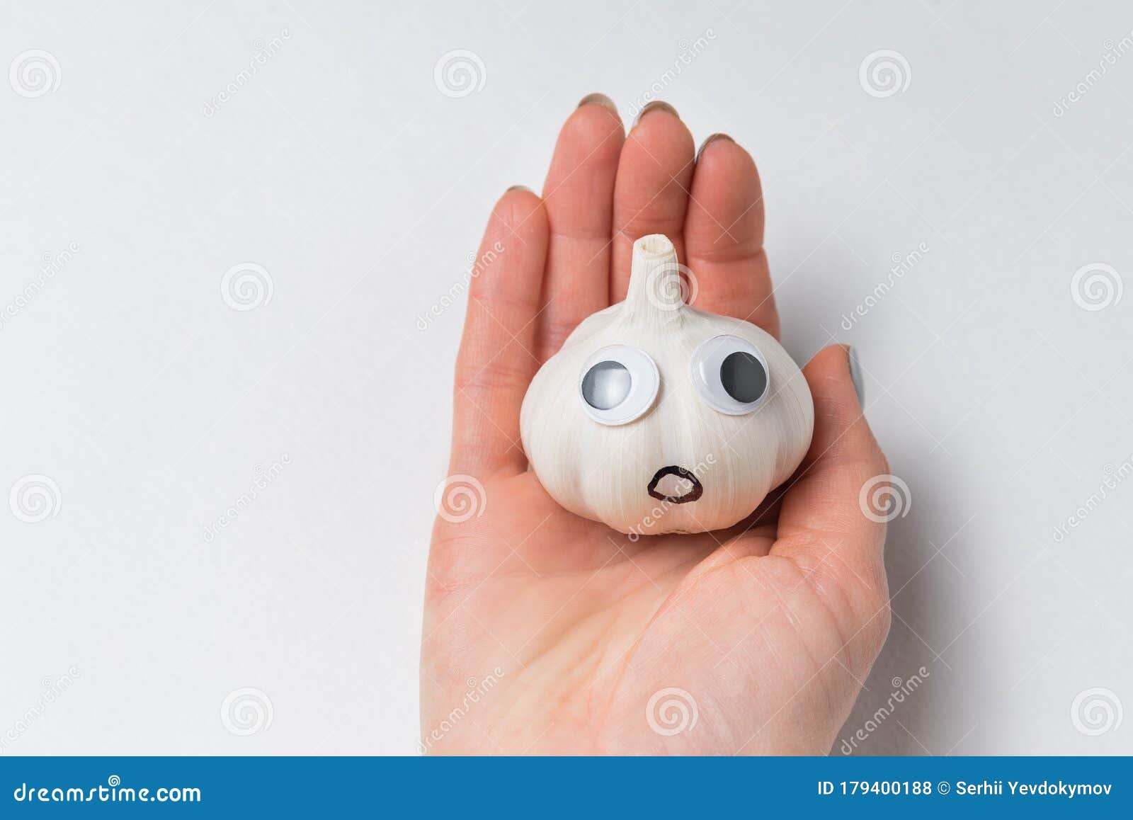 Garlic Character with Funny Face Rests on Palm. White Background Stock ...