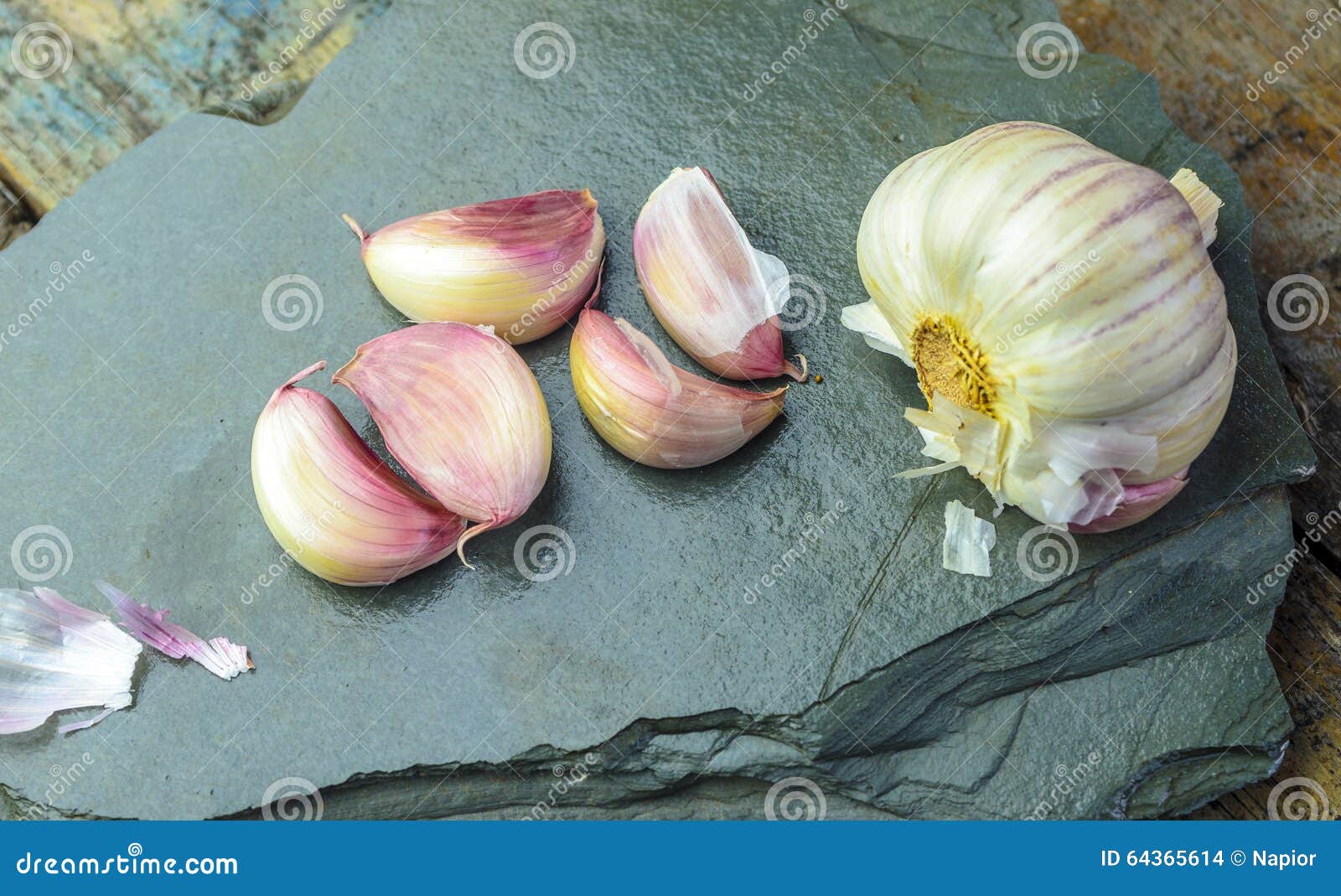 Garlic Cloves on Blue Stone. Stock Photo - Image of stone, closeup ...