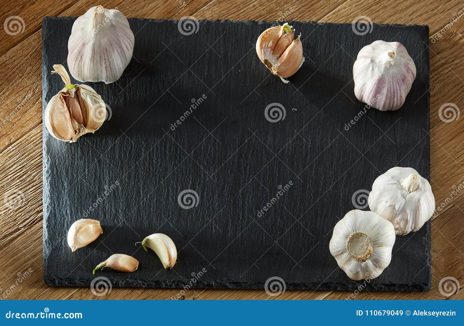 Garlic Composition Close Up on Black Flat Piece of Board, Copy Space ...