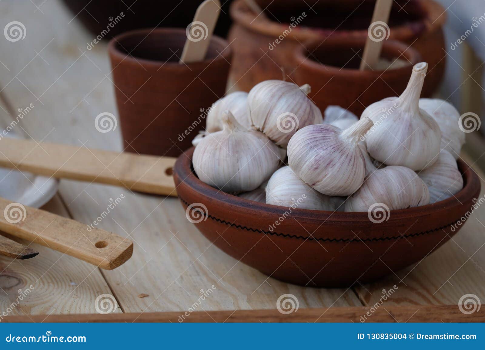 Garlic in a Cup stock photo. Image of clay, head, table - 130835004