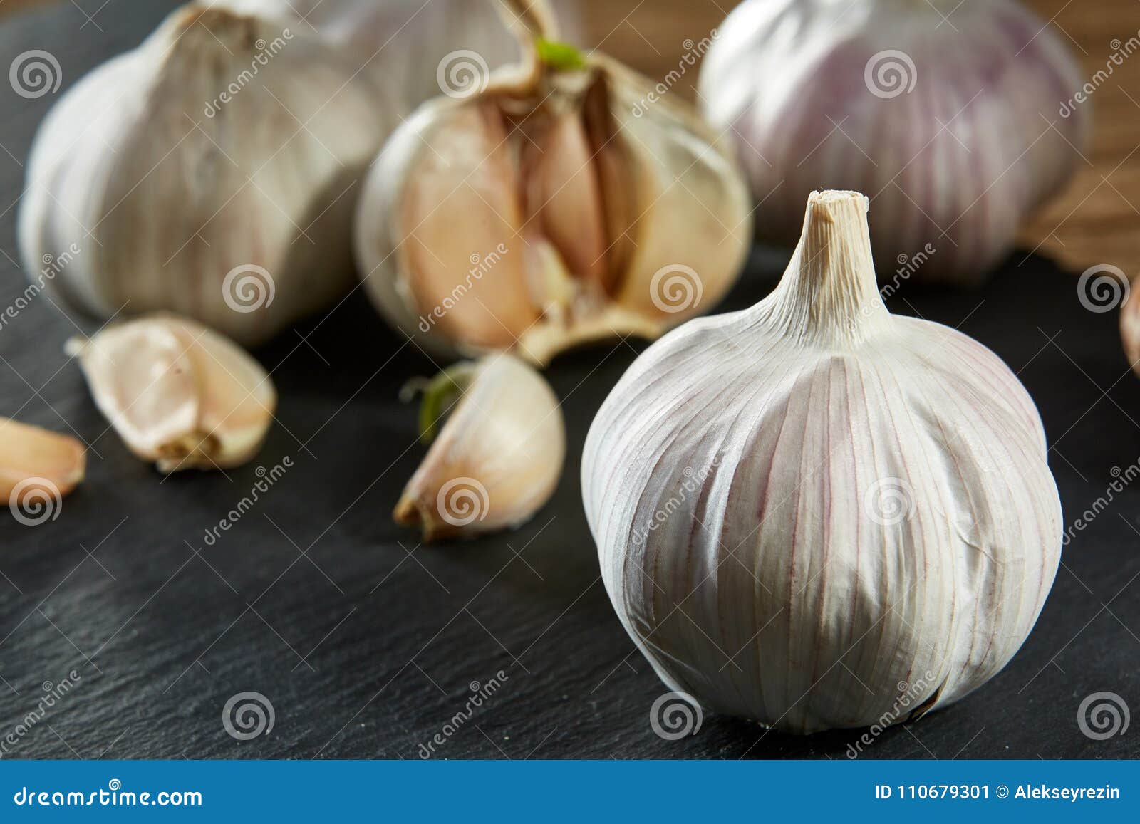 Garlic Close Up on Black Piece of Board, Shallow Depth of Field ...