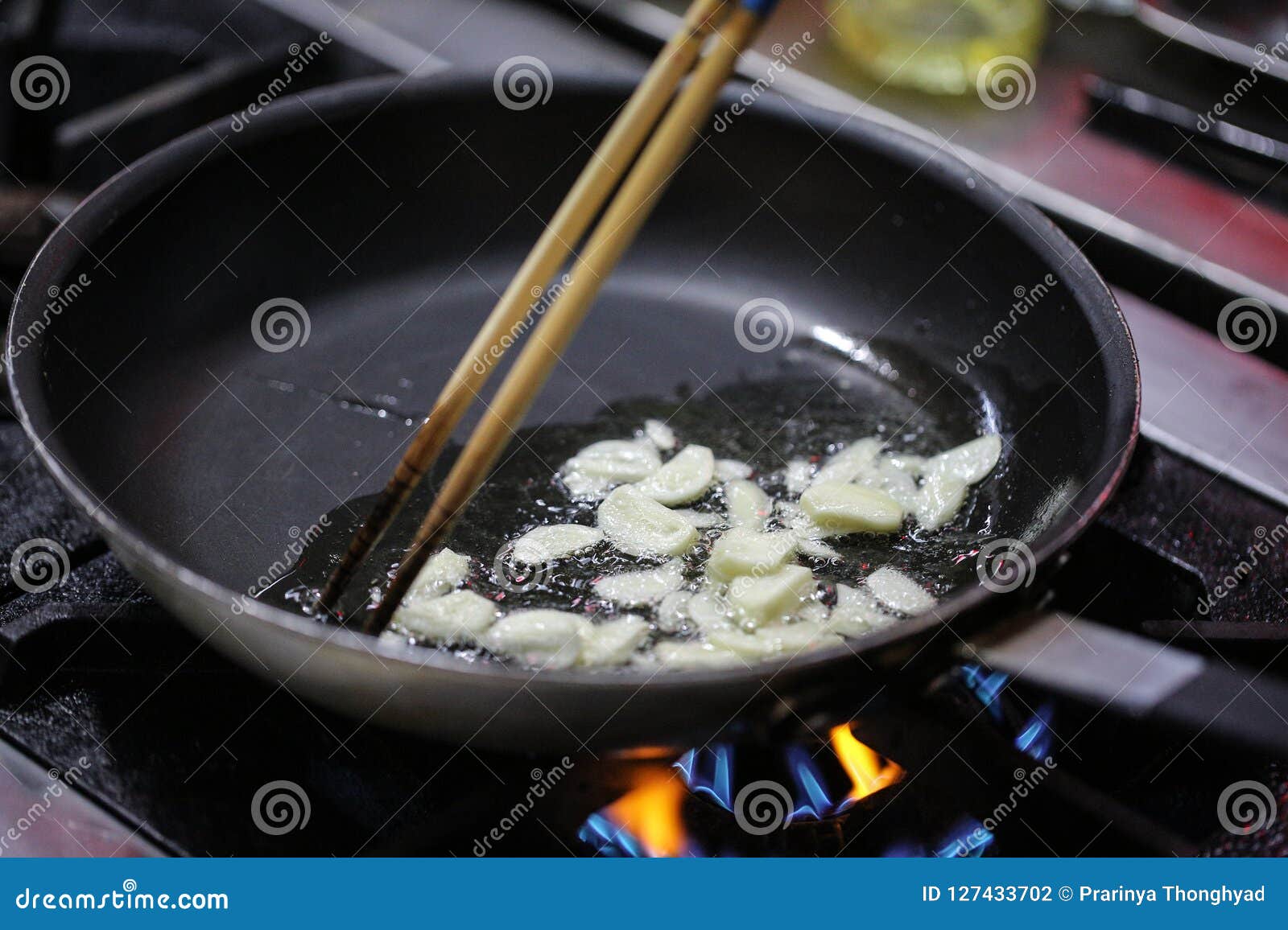 Garlic is Frying on Pan with Oil, Garlic with Frying Pan Stock Photo ...