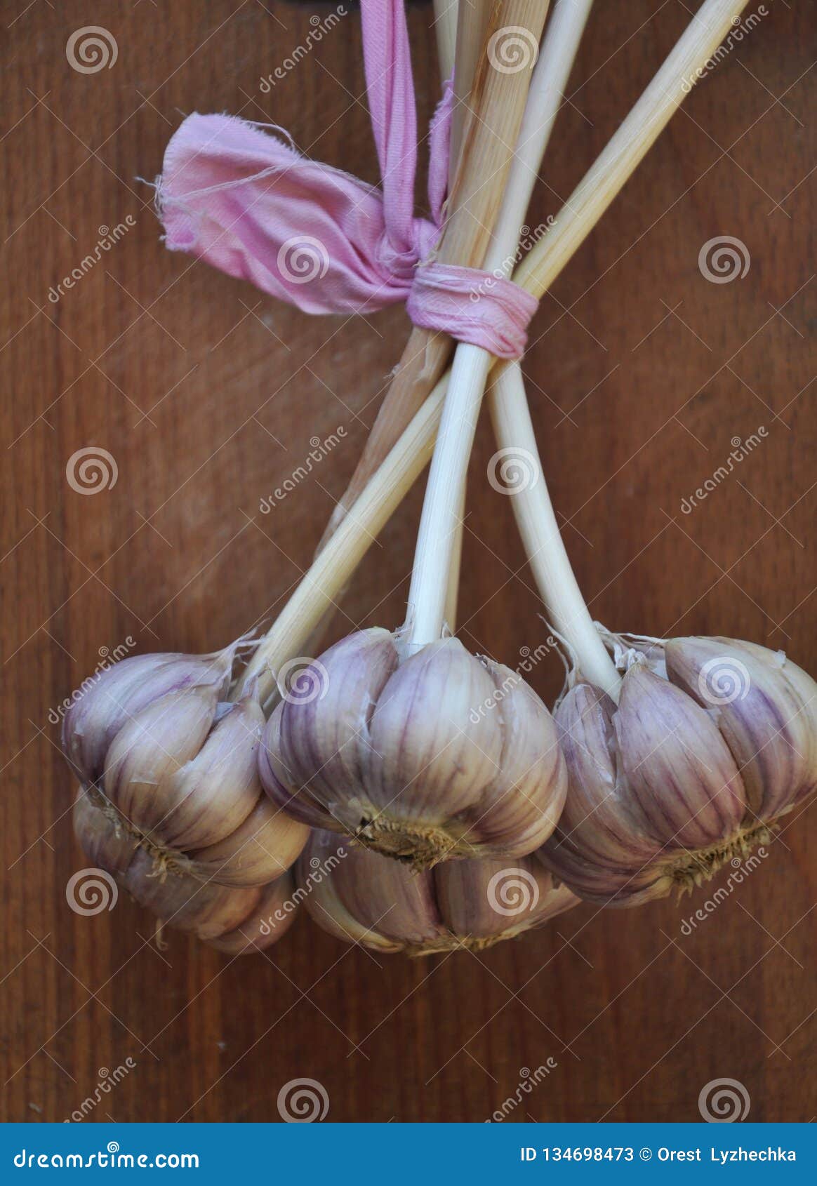 Garlic is tied to a bundle stock image. Image of wooden - 134698473