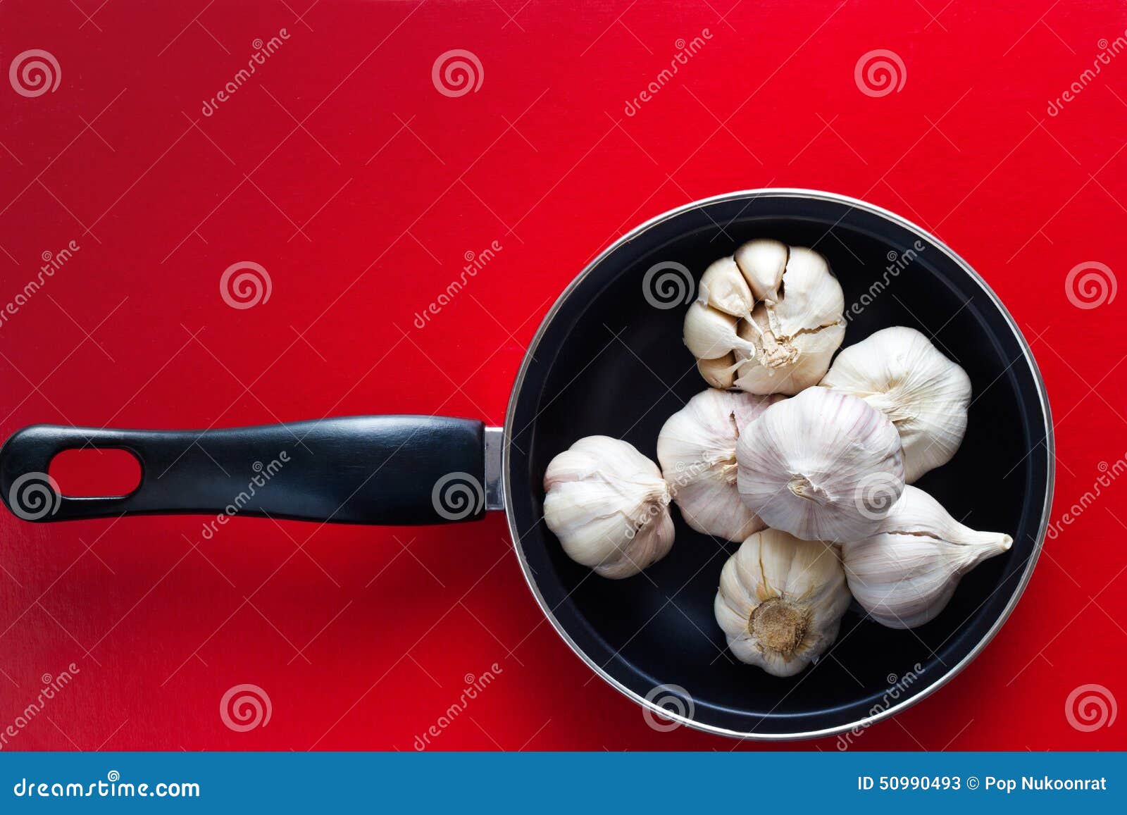 Garlic in the Pan on Red Background Stock Image - Image of healthy ...