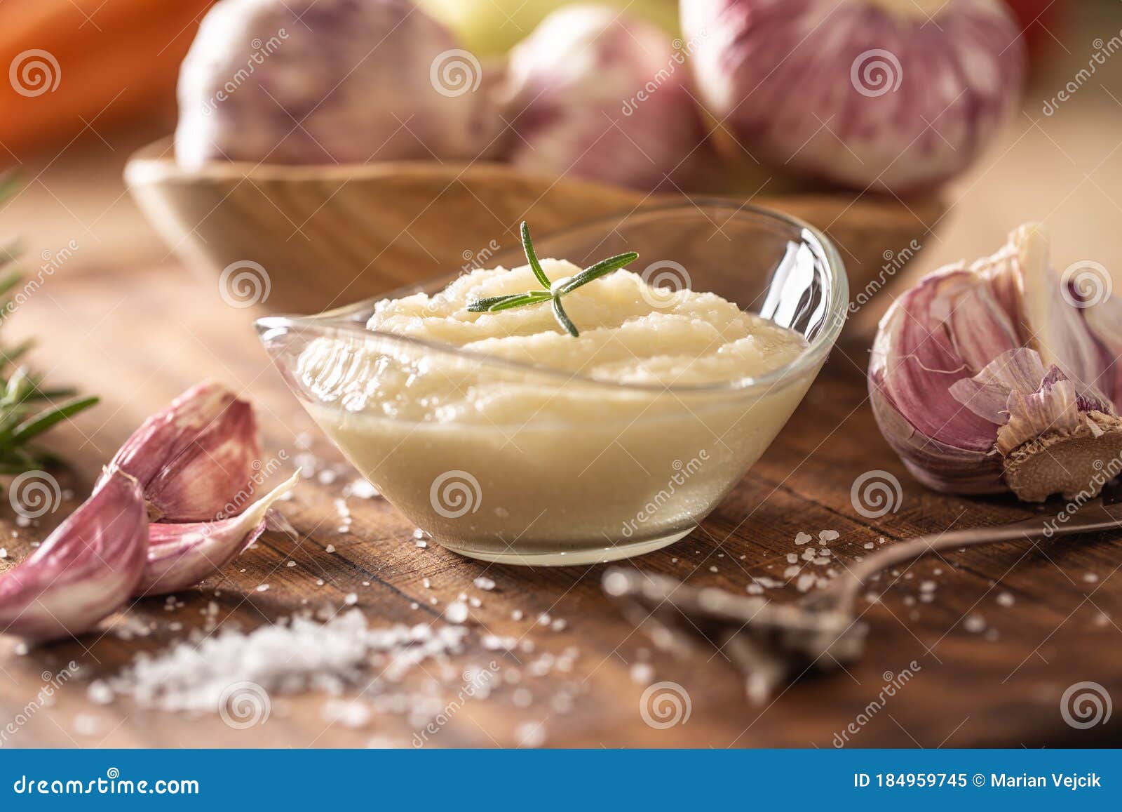 Garlic Paste in a Glass Bowl with Peeled Garlic, Salt and Garlic Heads ...