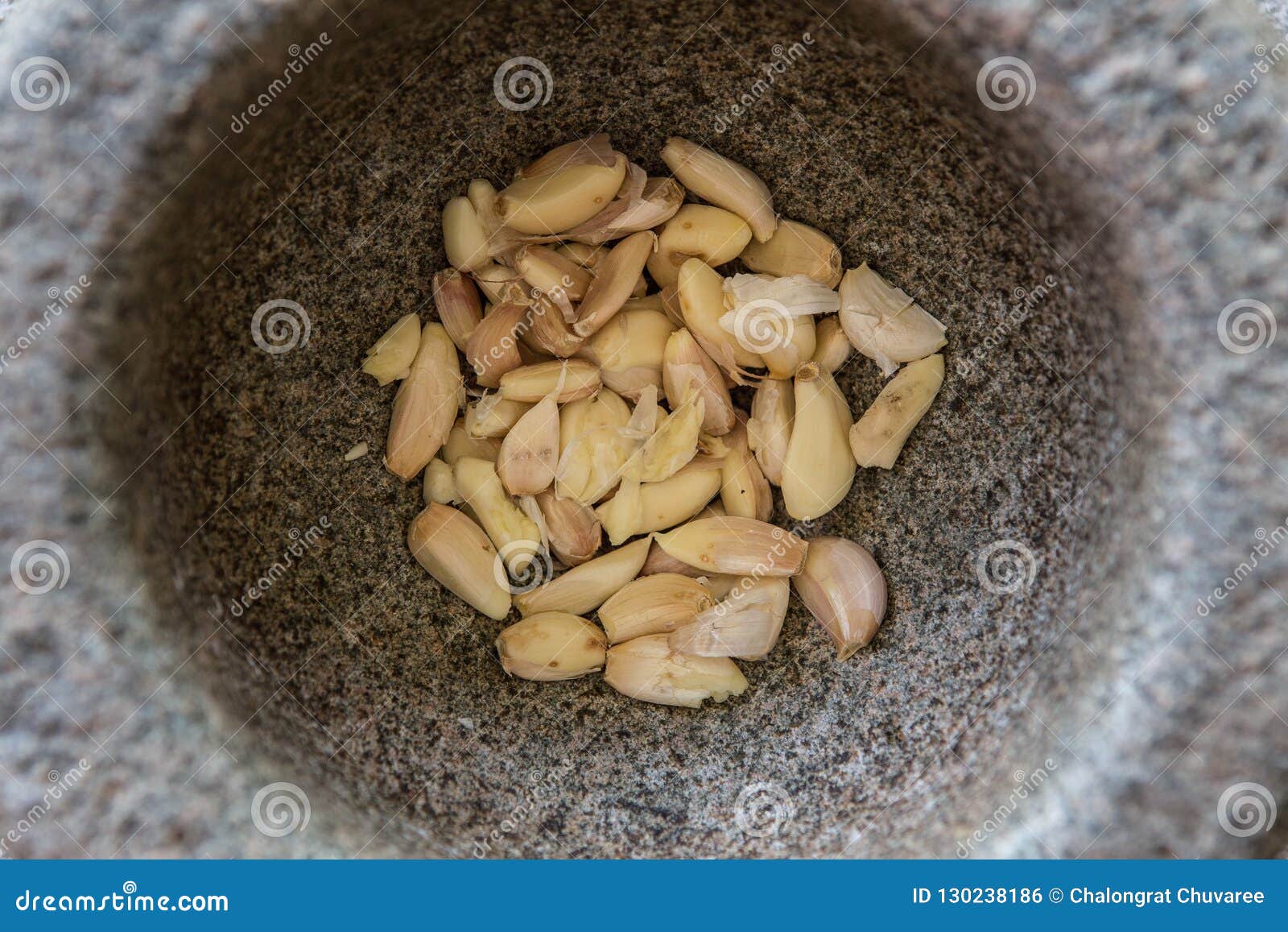 Garlic in stone mortar stock photo. Image of ripe, club - 130238186