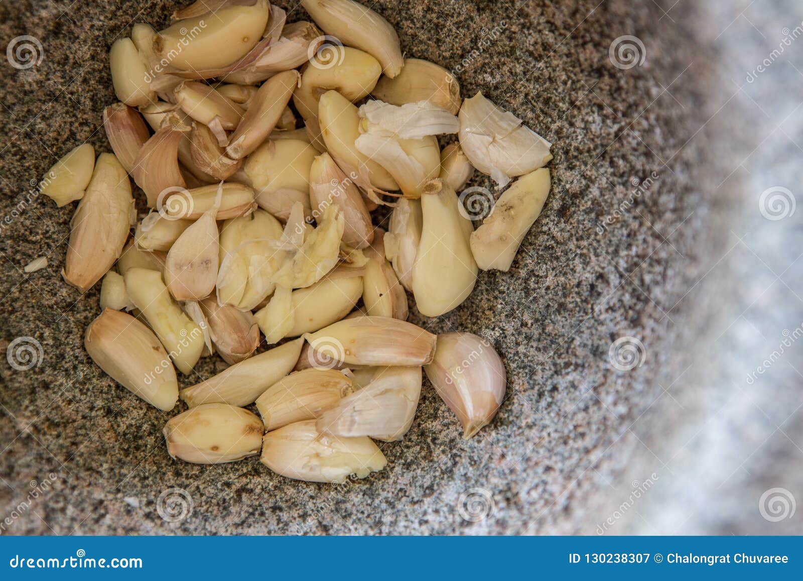 Garlic in stone mortar stock image. Image of ingredient - 130238307