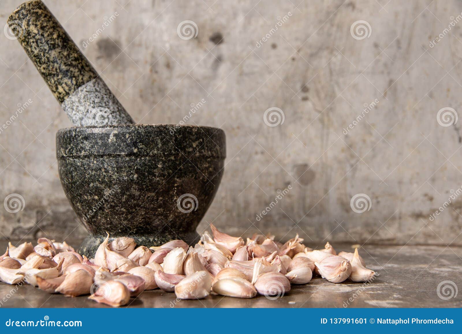 Garlic with Stone Mortar on Top of Cement Table Stock Image - Image of ...