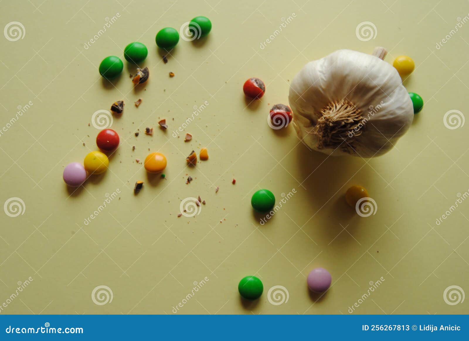 Garlic and candies 2 stock image. Image of sweets, food - 256267813
