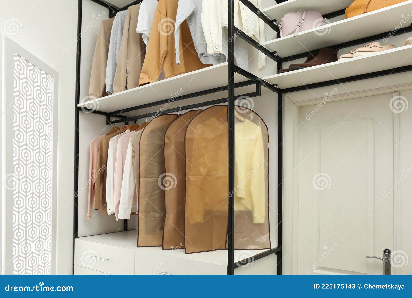 Garment Bags with Clothes on Rack in Dressing Room Stock Image - Image ...