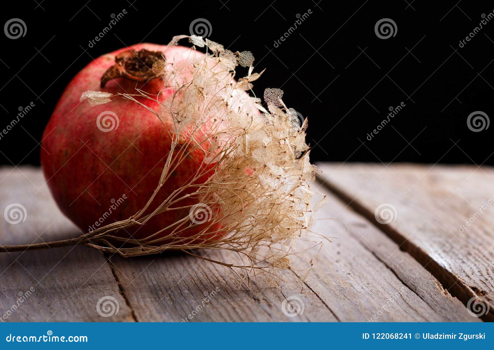 Garnet with a Branch on a Wooden Background Stock Image - Image of ...