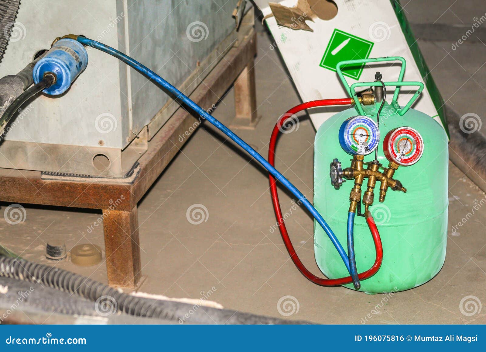 Gas is Being Refiling into the Heavy Ac Compressor of Central Air ...