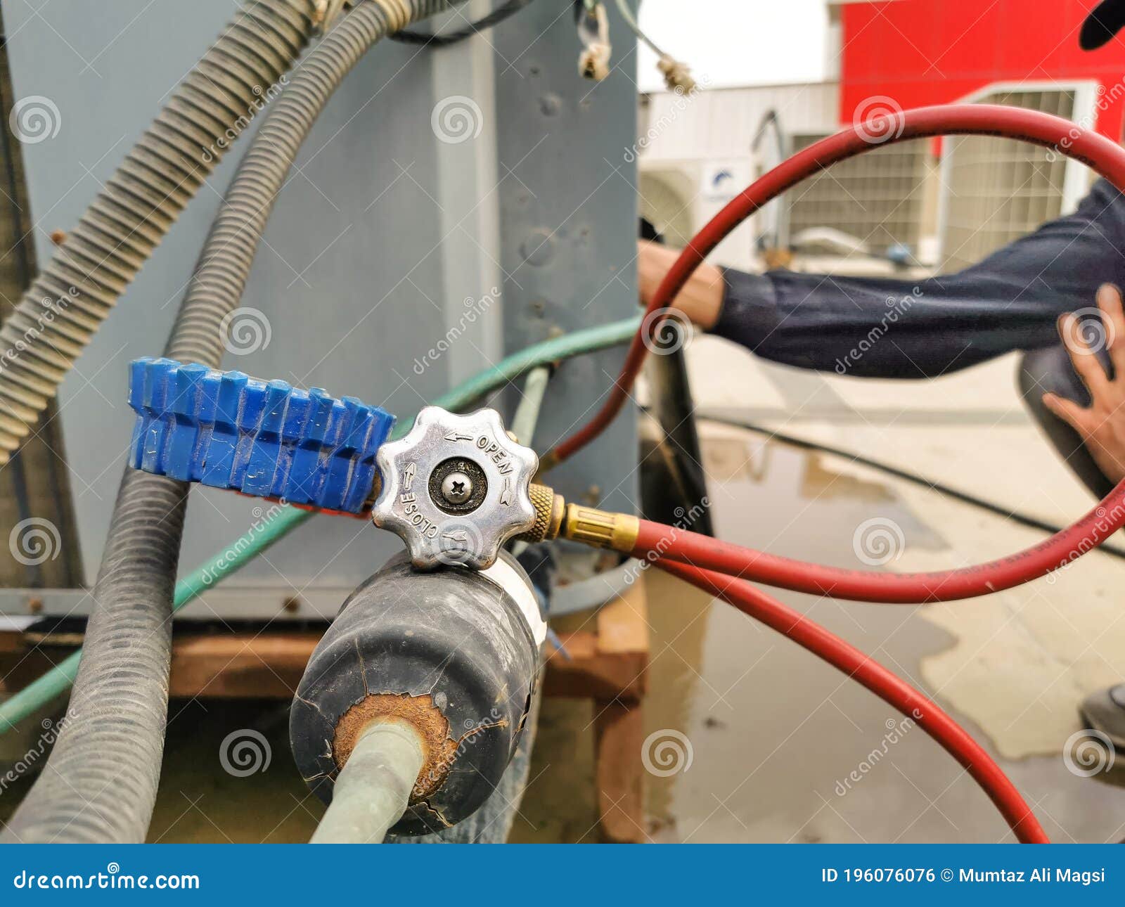 Gas is Being Refiling into the Heavy Ac Compressor of Central Air ...