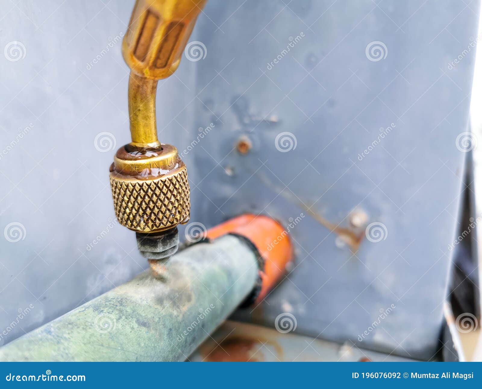 Gas is Being Refiling into the Heavy Ac Compressor of Central Air ...