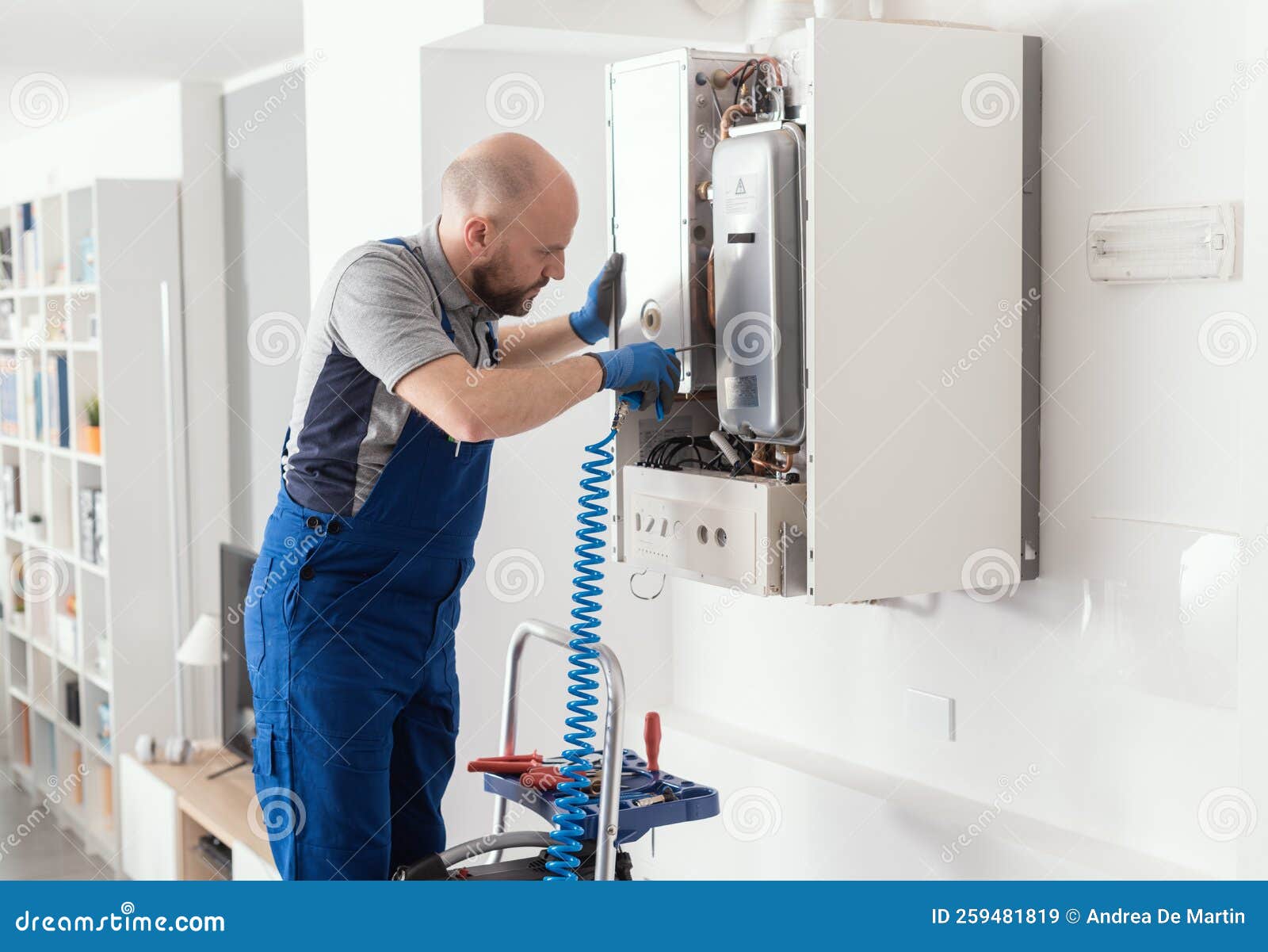 Professional Engineer Servicing a Boiler at Home Stock Image - Image of ...