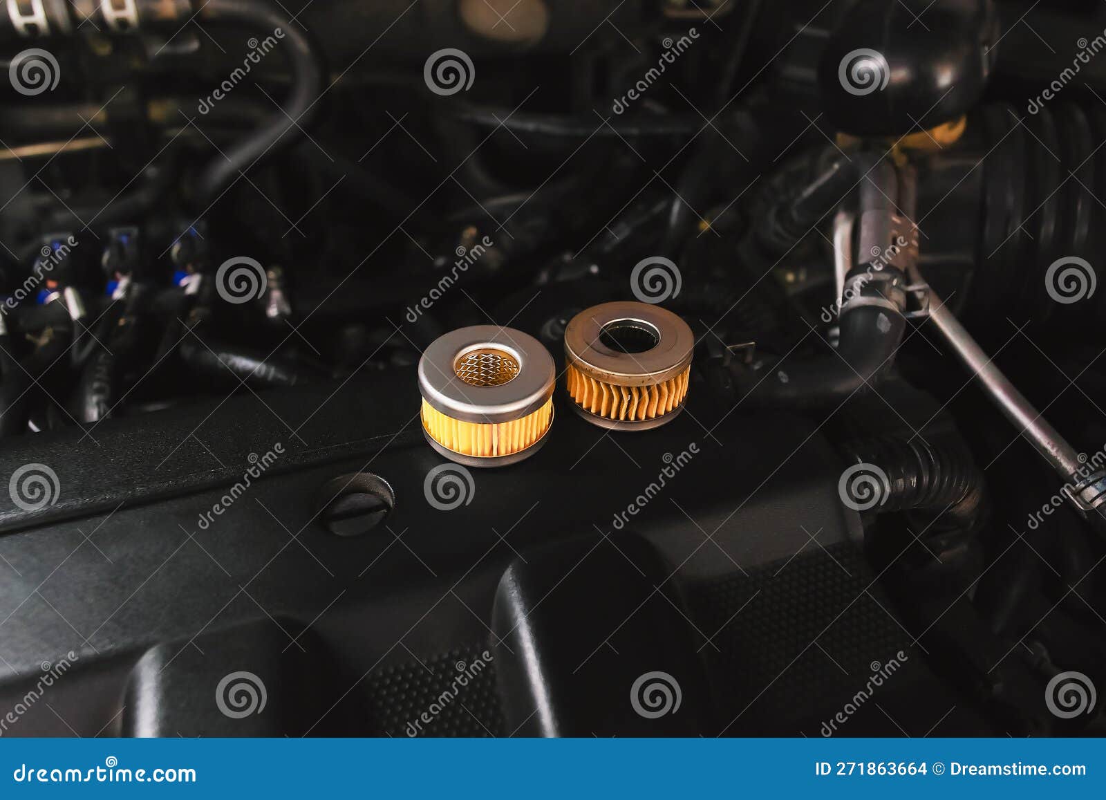 Gas Filter Comparison New and Old Placed on Car Engine Compartment ...