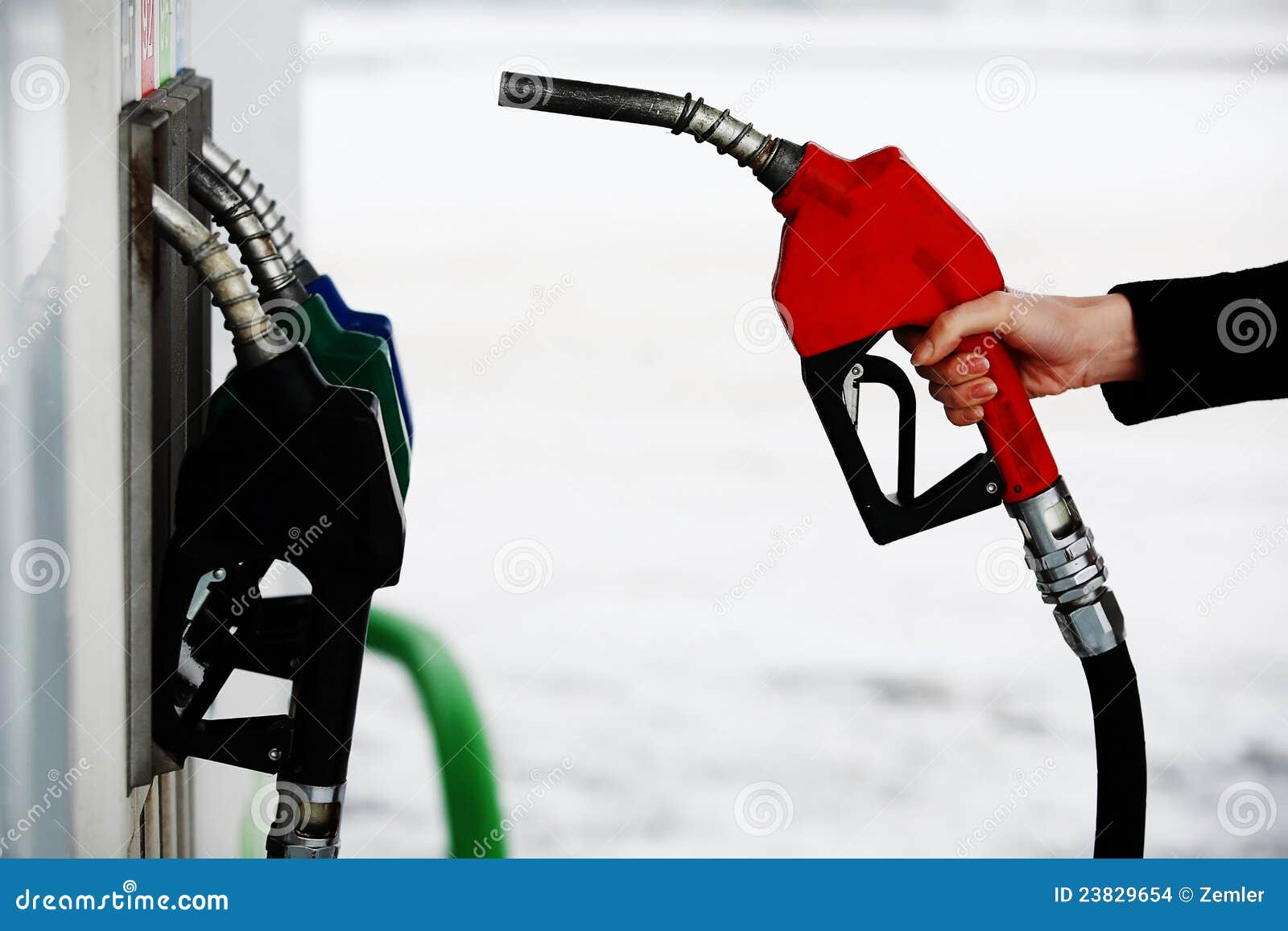 Gas nozzle in woman s hand stock photo. Image of trip - 23829654