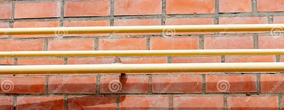 A Gas Pipe Hangs on a Brick Wall Stock Image - Image of device, white ...