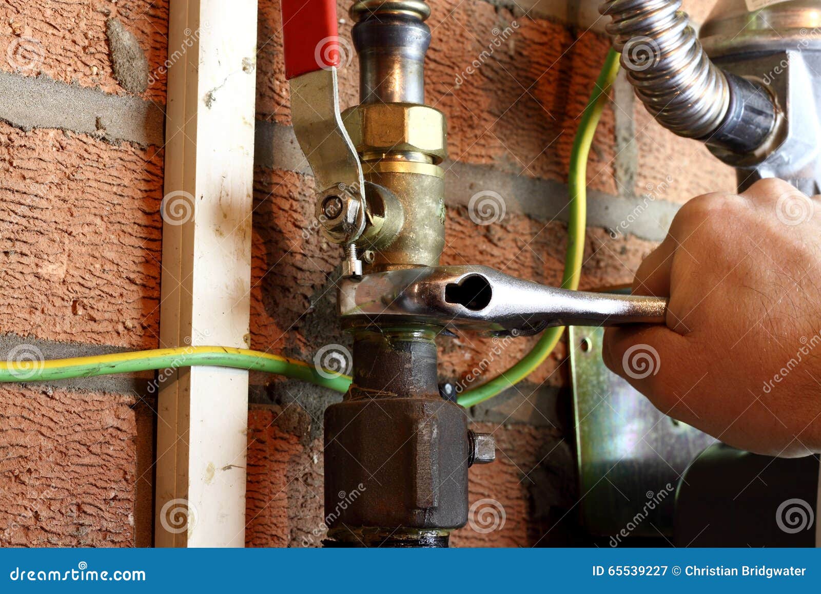 Gas pipe man connecting stock image. Image of hand, maintenance - 65539227