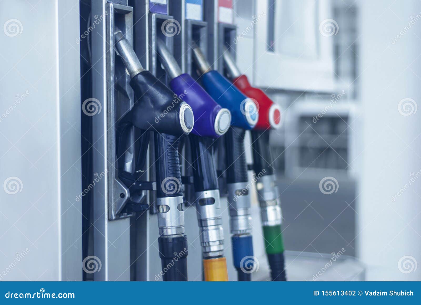 Gas Station Close-up with Colored Fuel Hoses. Stock Photo - Image of ...