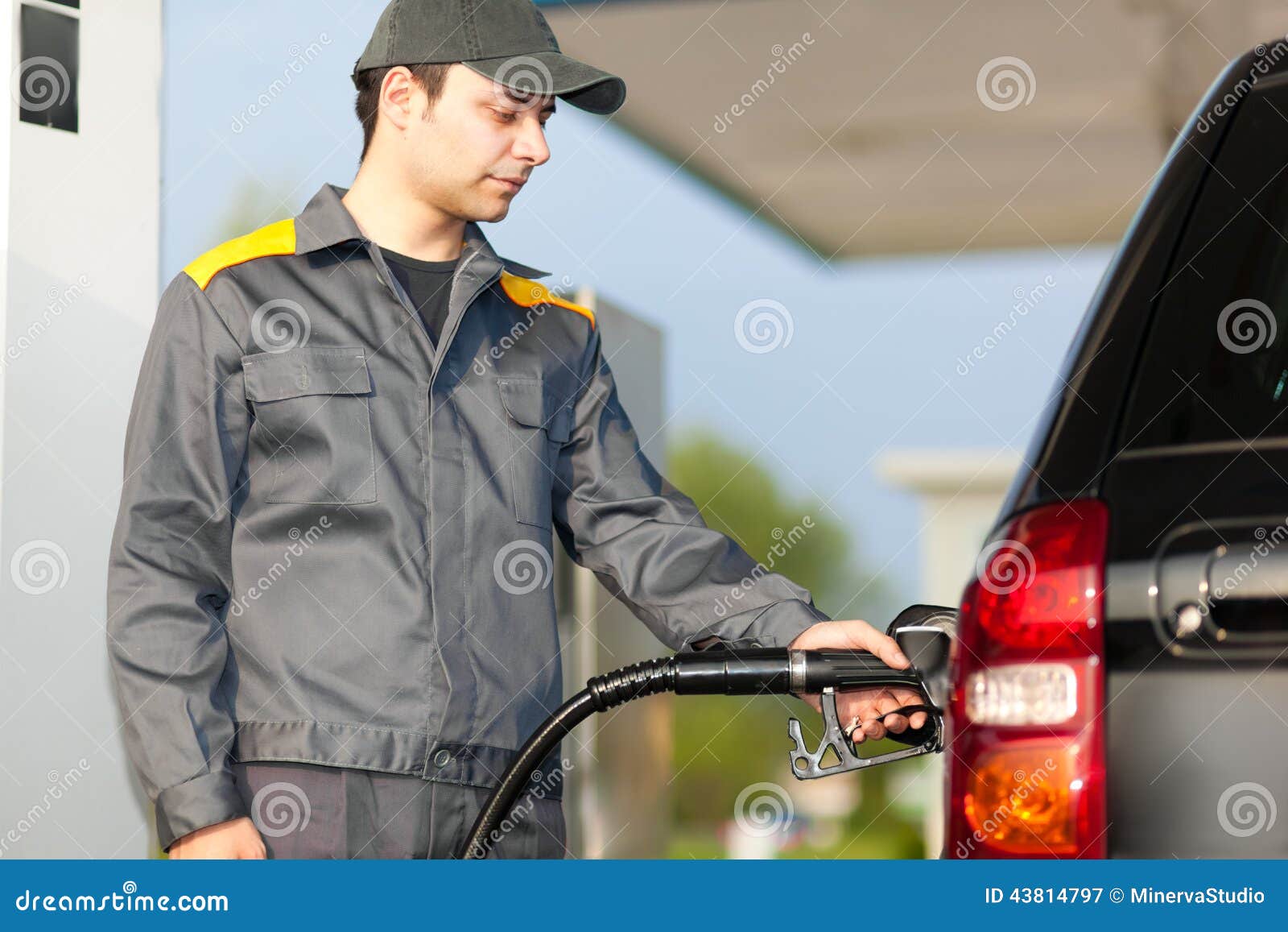 Gas Station Worker Refilling Car at Service Station Stock Image - Image ...